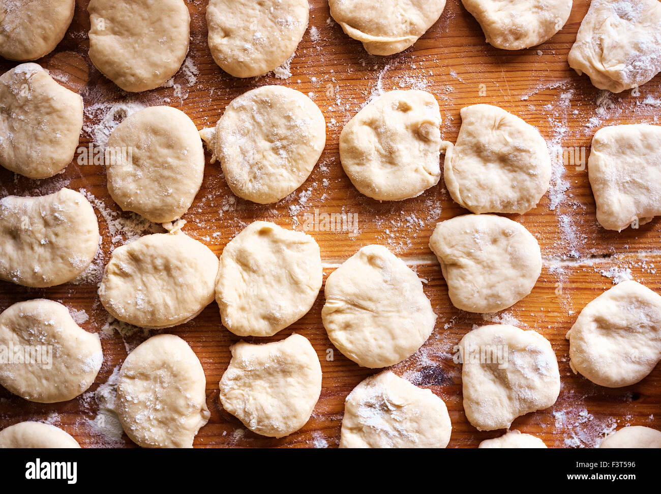 Round unbaked pies Stock Photo - Alamy