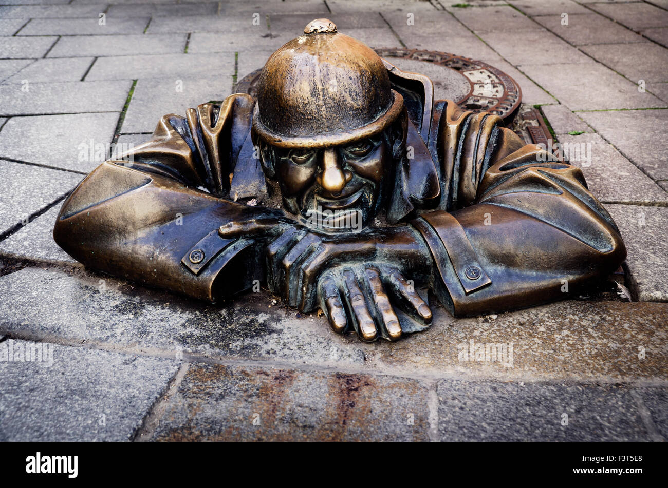Man at work, statue in Bratislava, Slovakia Stock Photo - Alamy