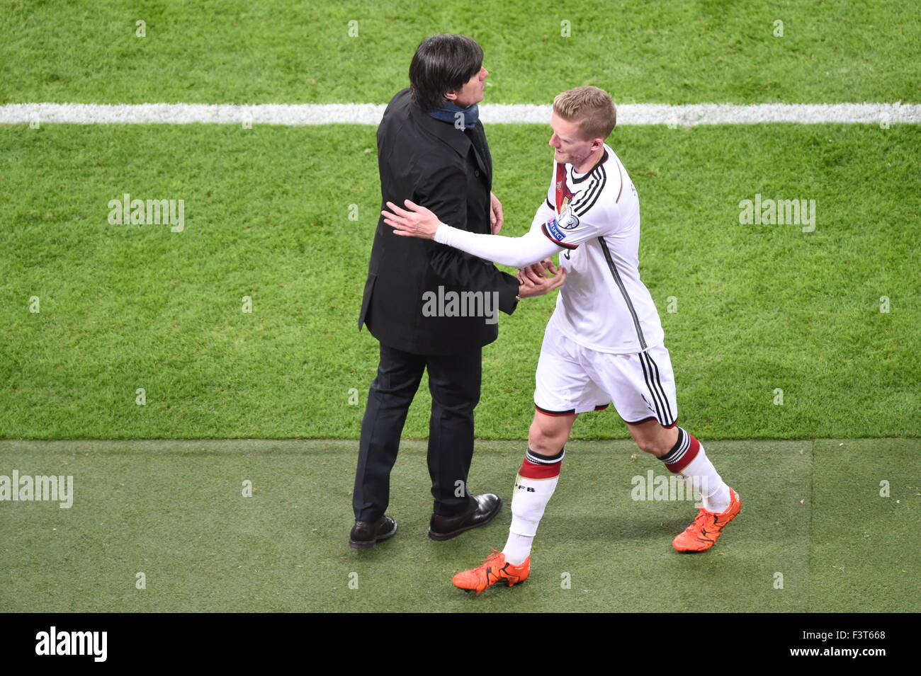Leipzig, Germany. 11th Oct, 2015. Germany's Andre Schuerrle (R) shakes ...