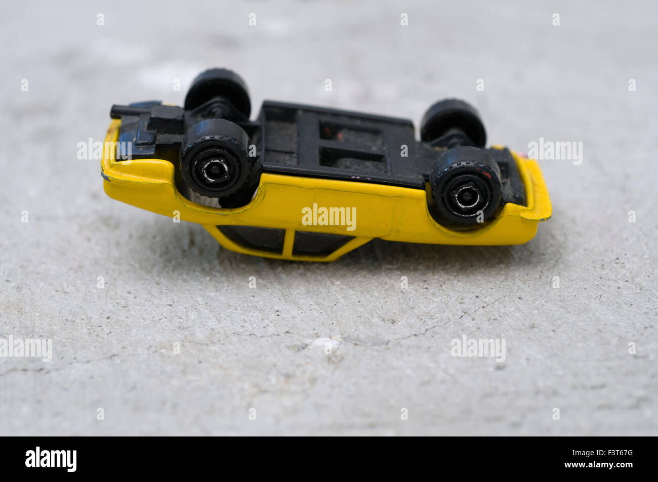 Toy car upside down Stock Photo - Alamy