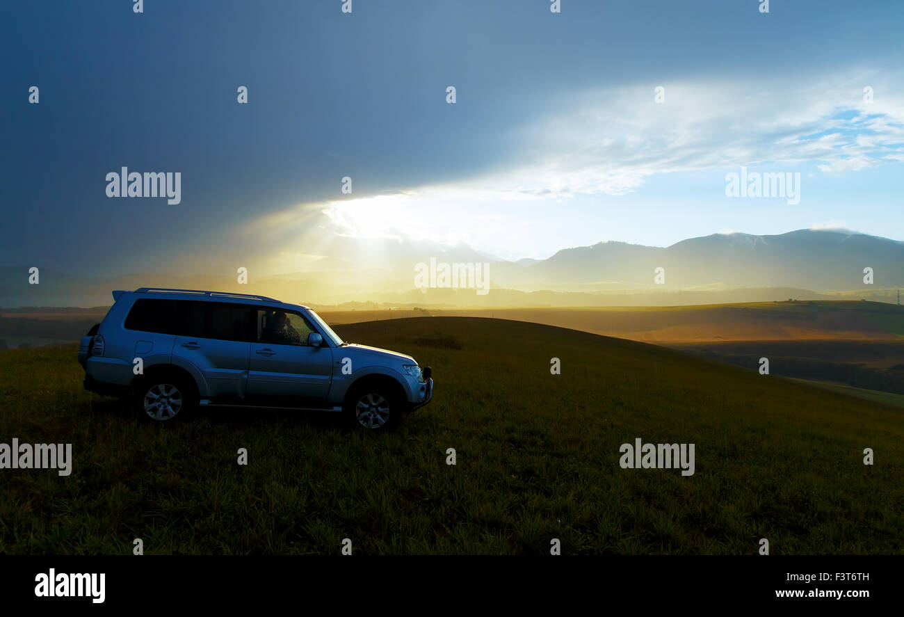 car in landscape with Light from the sky and beautiful cloudy with ...