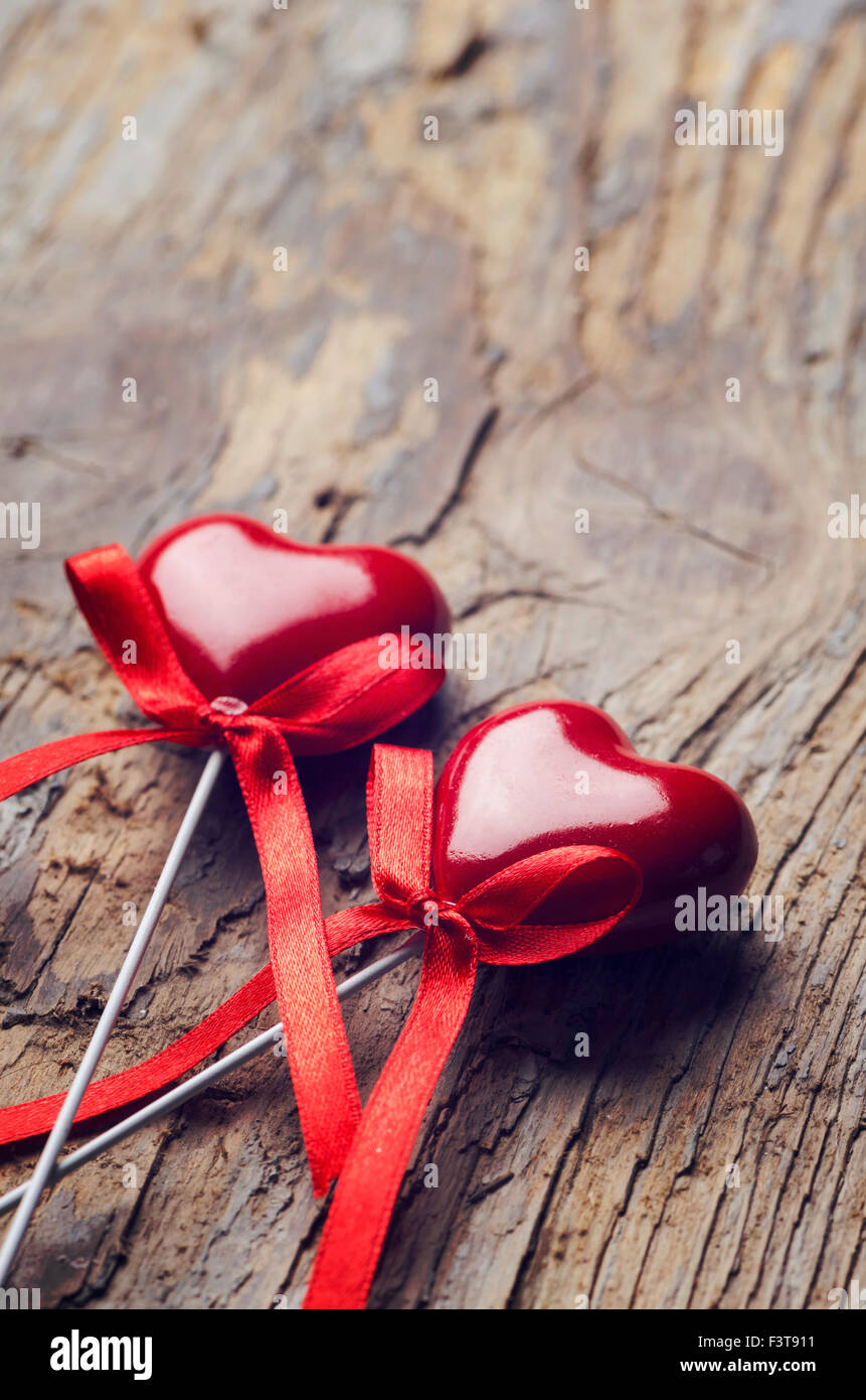 Valentine hearts on rustic wooden table Stock Photo - Alamy