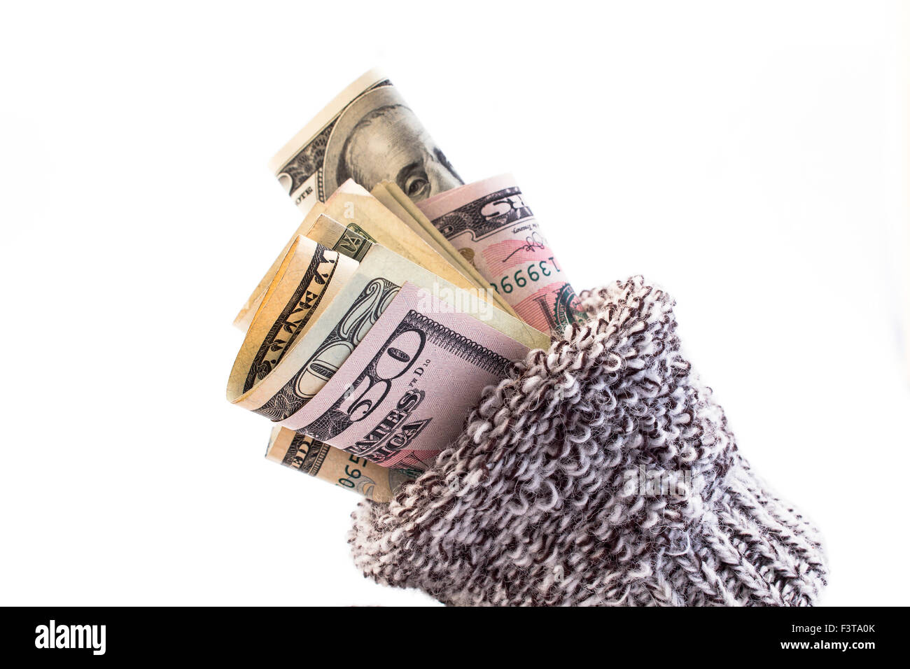 Money in a sock isolated on white Stock Photo - Alamy