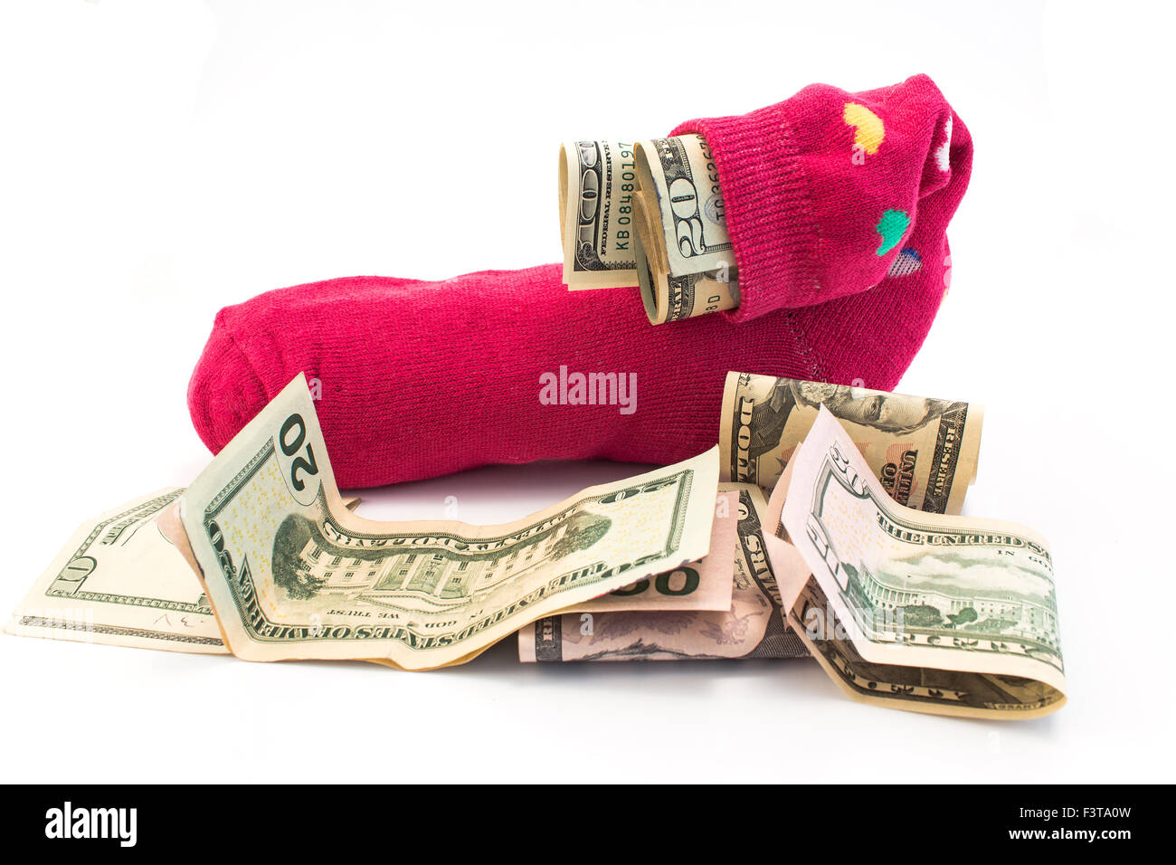 Money in a sock isolated on white Stock Photo - Alamy