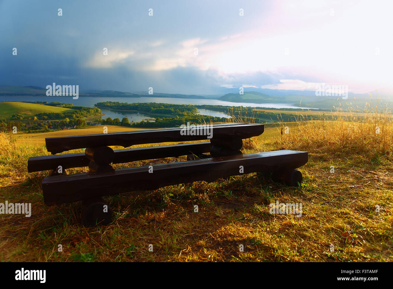 Beautiful landscape, lake with village. Seating overlooking on ...