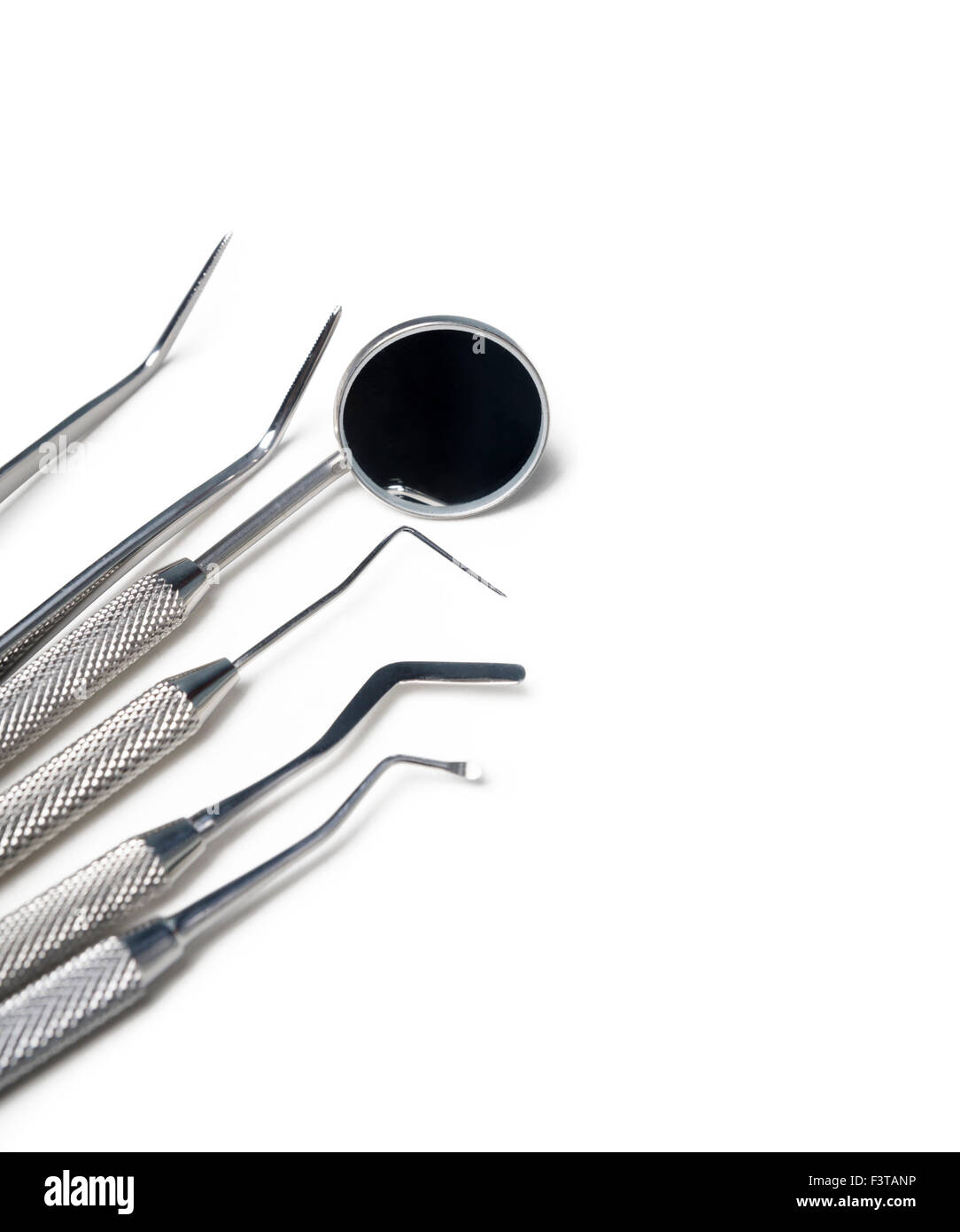 Dental instruments closeup isolated over white Stock Photo - Alamy
