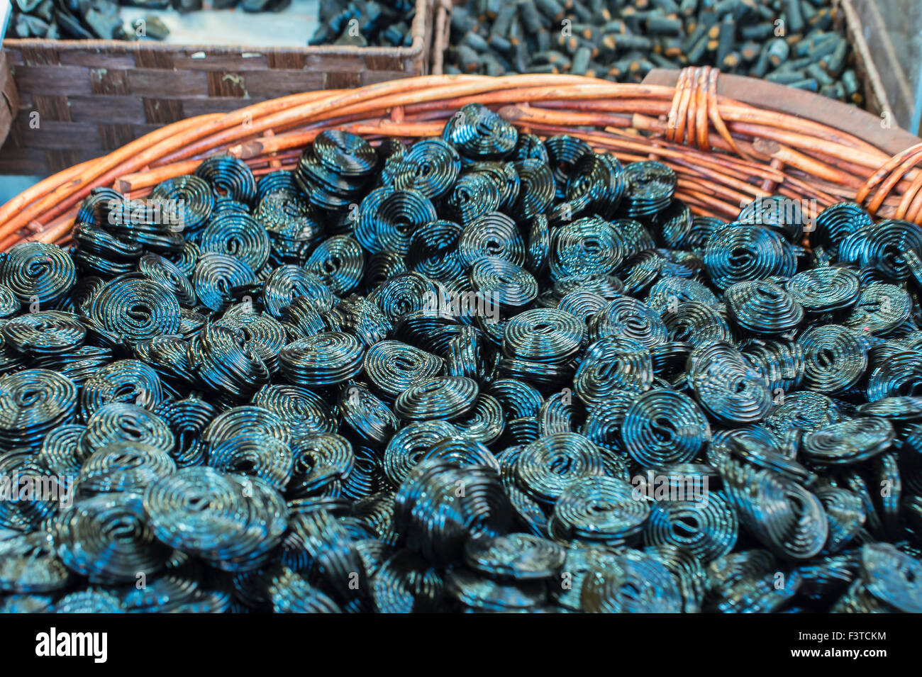 spirals of licorice in the basket on display in a market Stock Photo ...