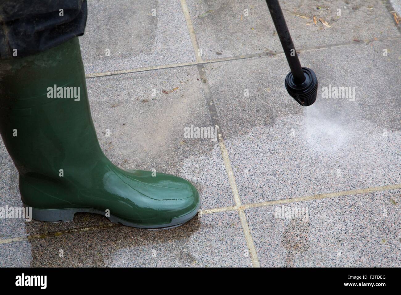 Outdoor floor cleaning with high pressure water jet Stock Photo - Alamy