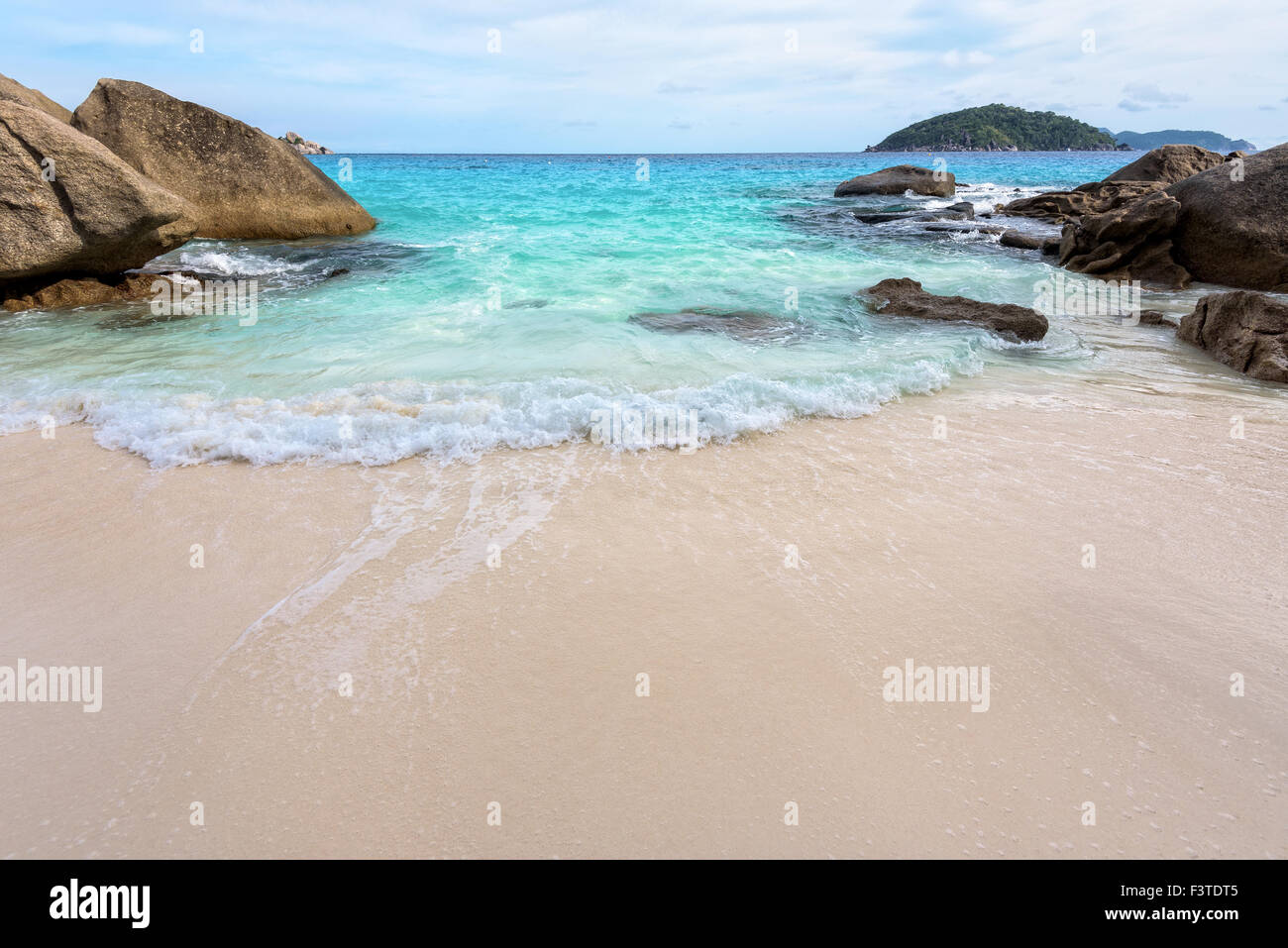Beautiful nature of blue sea sand and white waves on small beach near ...