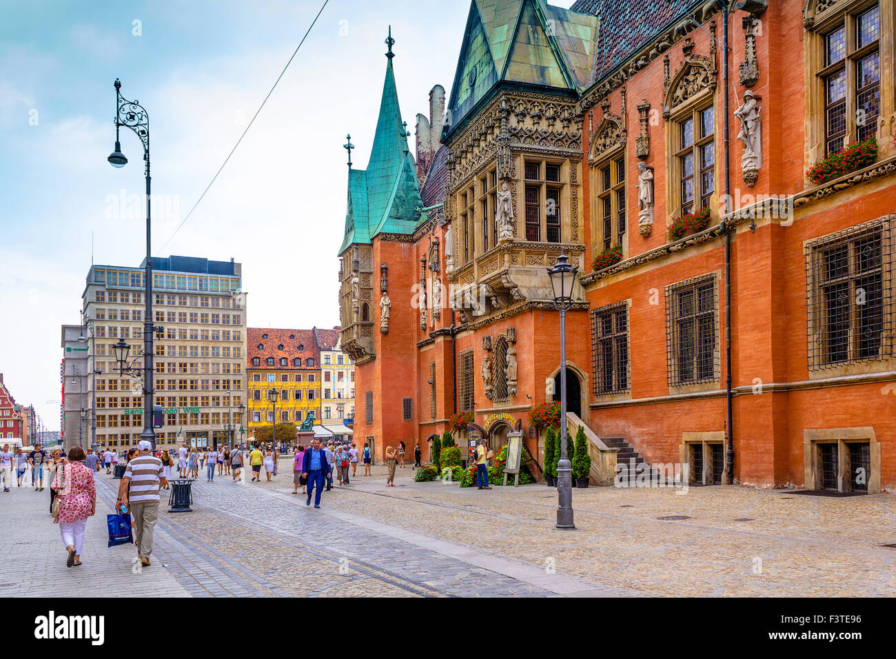 Old Town Hall and People walking in the Old Town, Market Square ...