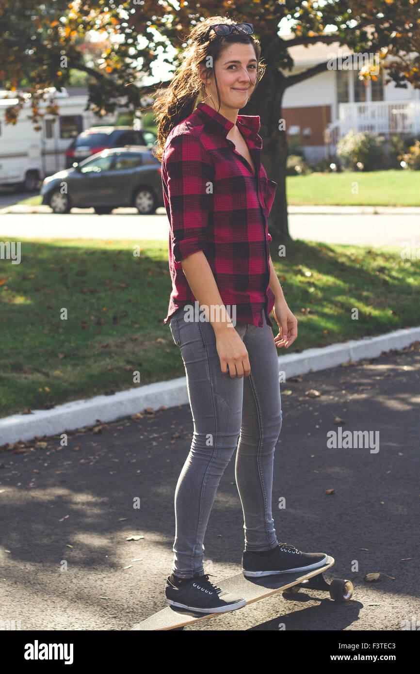 woman riding longboard skateboard at fall on daytime Stock Photo - Alamy
