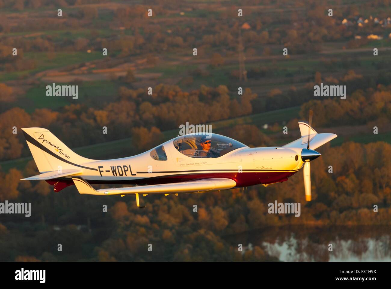 France, Bas Rhin (67), Aerospool Dynamic plane flying in sunset light ...