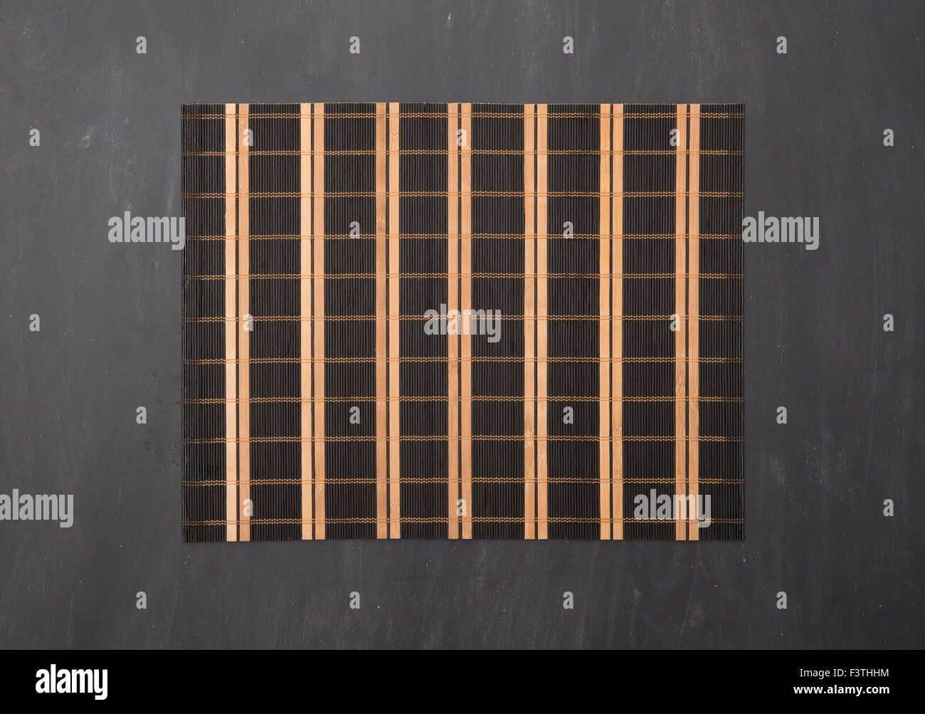 Bamboo place mat on wooden deck table Stock Photo - Alamy