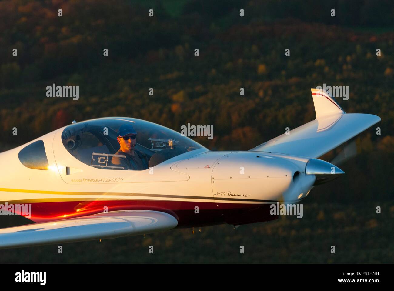 France, Bas Rhin (67), Aerospool Dynamic plane flying in sunset light ...