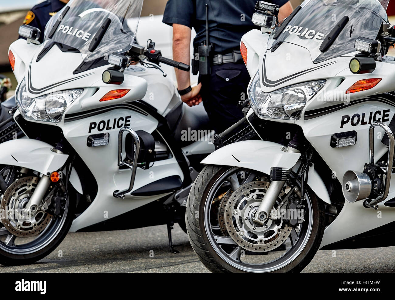 Police motorcycles parked on road Stock Photo - Alamy