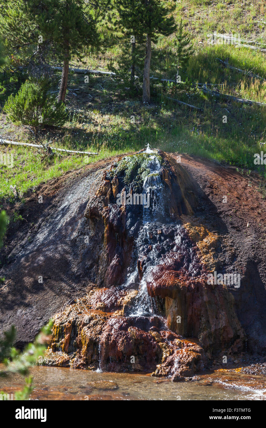 A volcanic vent releasing hot water that has created a colorful ...