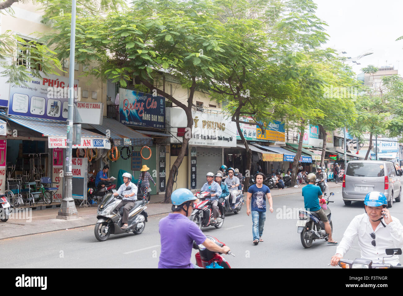Ho Chi Minh city Vietnam, man attempting to cross the road and man ...