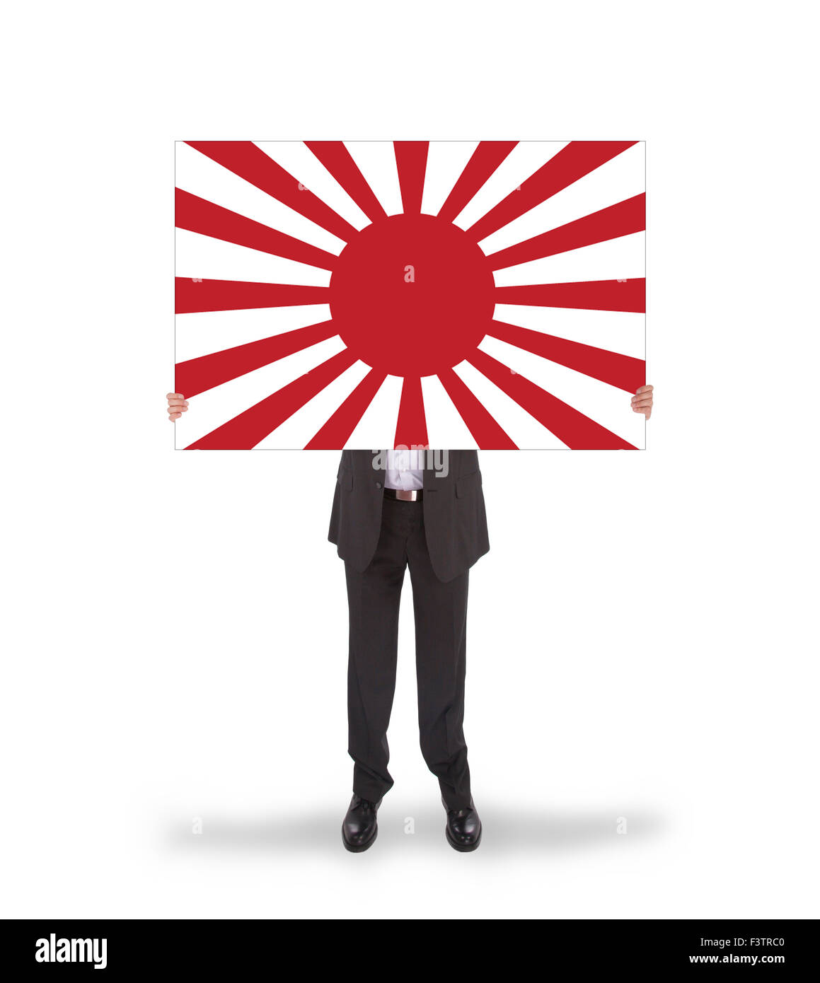 Smiling businessman holding a big card, flag of Japan, isolated on ...