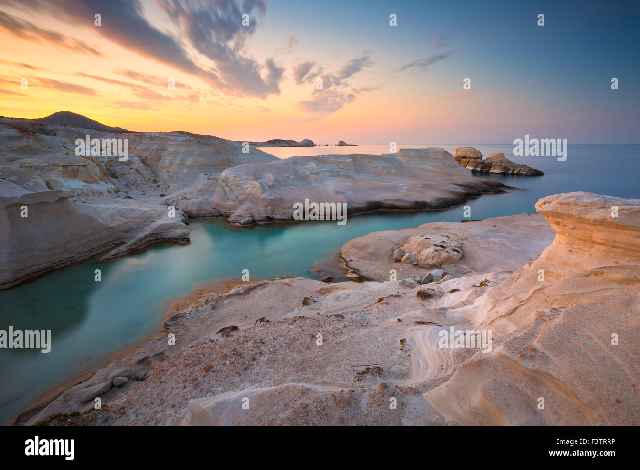 Sarakiniko beach on Milos island in sunset Stock Photo - Alamy