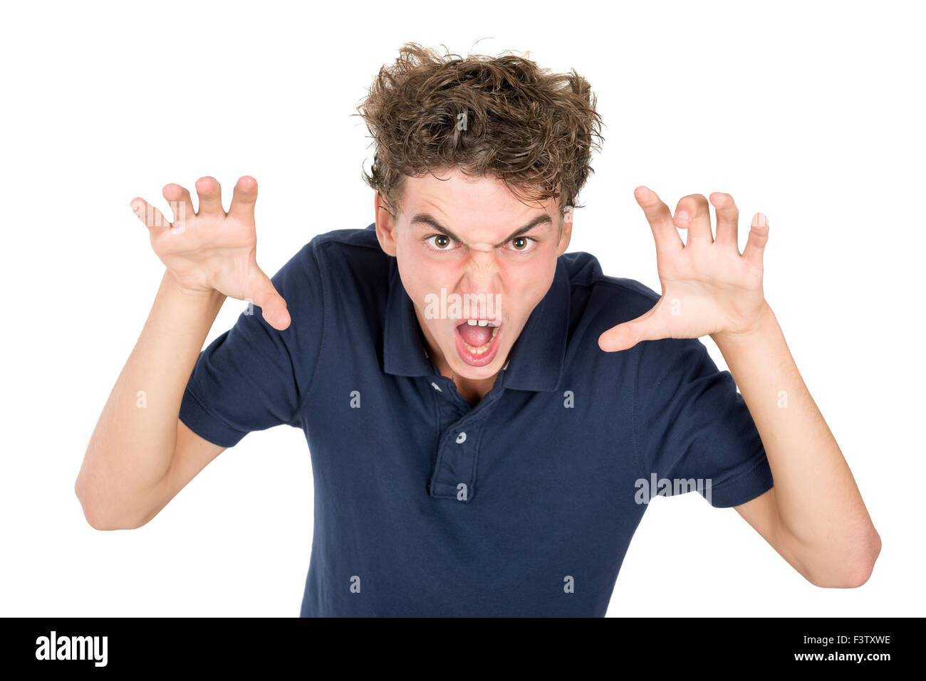 Angry teenage boy making faces isolated in white Stock Photo - Alamy