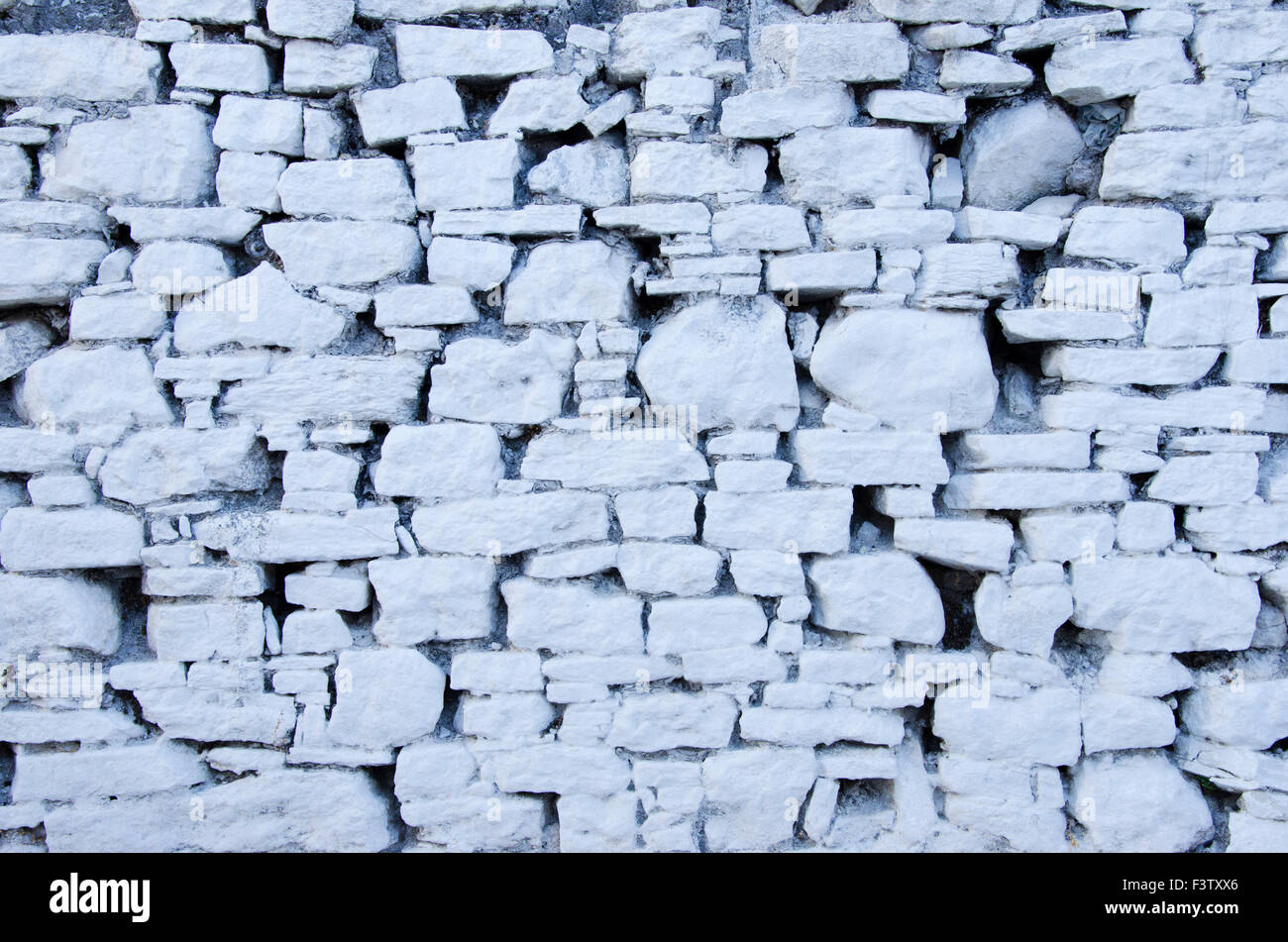 A wall made of white stones Stock Photo - Alamy