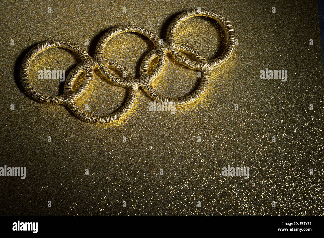 RIO DE JANEIRO, BRAZIL - FEBRUARY 3, 2015: Gold Olympic rings symbol ...