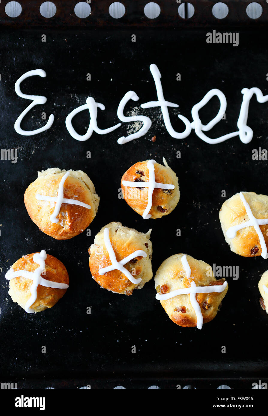 easter hot cross buns on black background Stock Photo - Alamy
