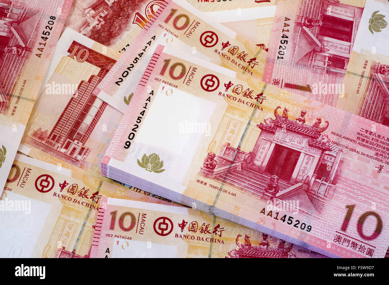 The stack of Macau Patacas as background Stock Photo - Alamy