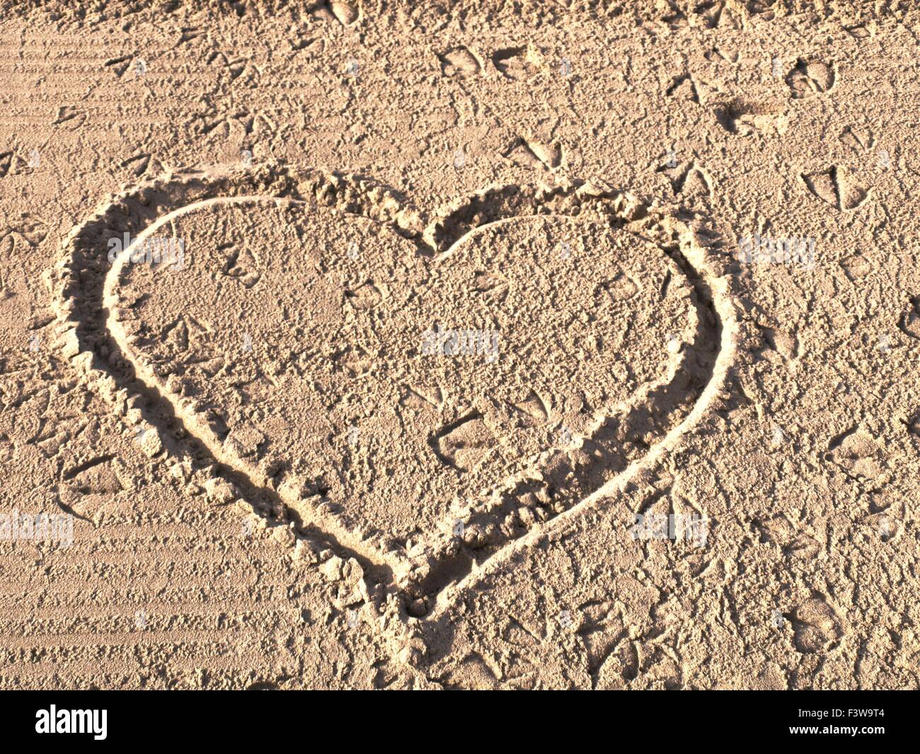 Heart in sand Stock Photo - Alamy