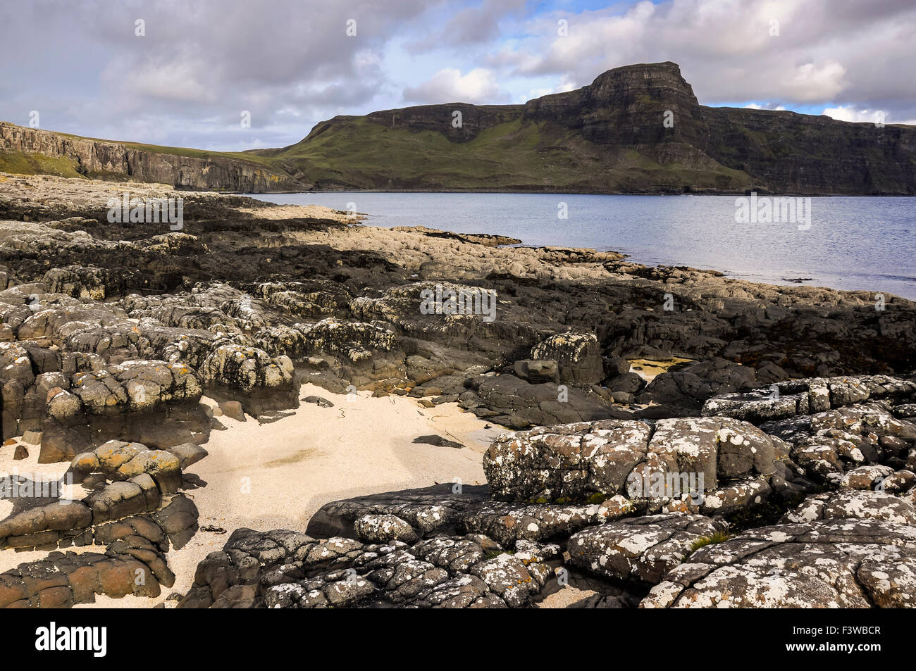 Waterstein Head on the Isle of Skye, Scotland. A small beach with pale ...