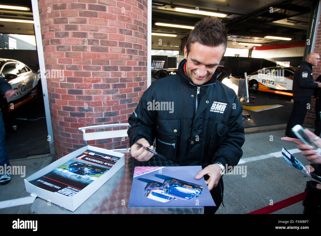 Colin Turkington Team BMR signing autographs at Brands Hatch 2015 Stock ...