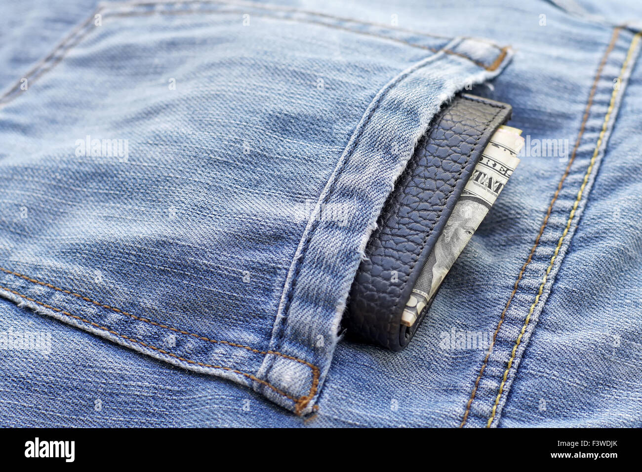 old wallet in back pocket blue jeans Stock Photo - Alamy