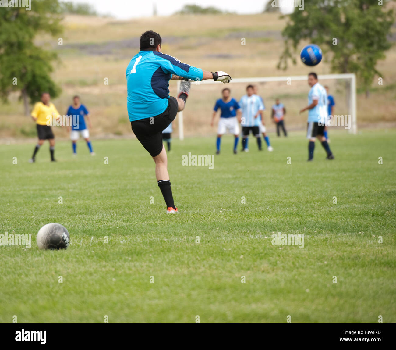 goalie kicks the ball Stock Photo - Alamy