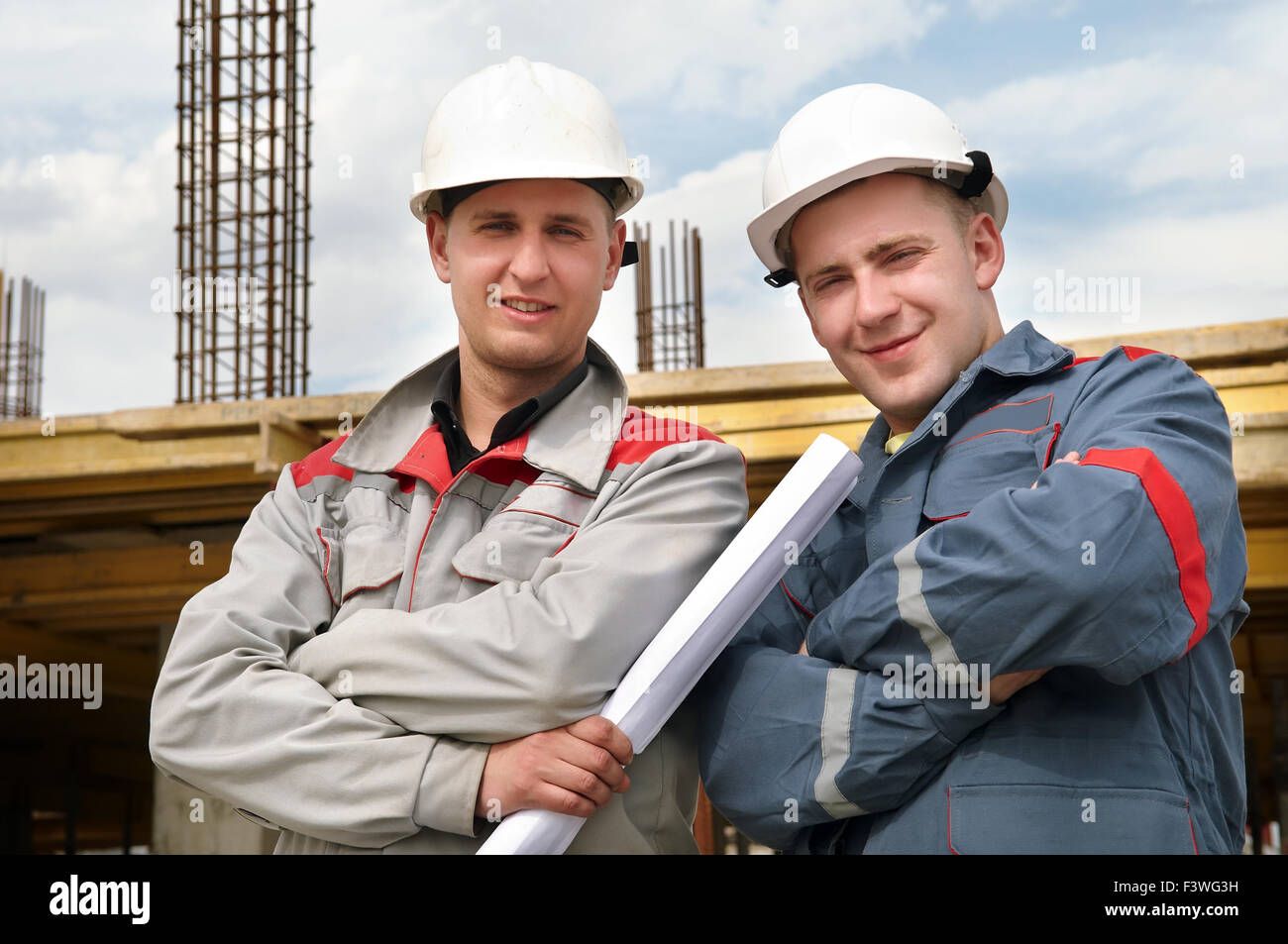 Engineers builders at construction site Stock Photo - Alamy