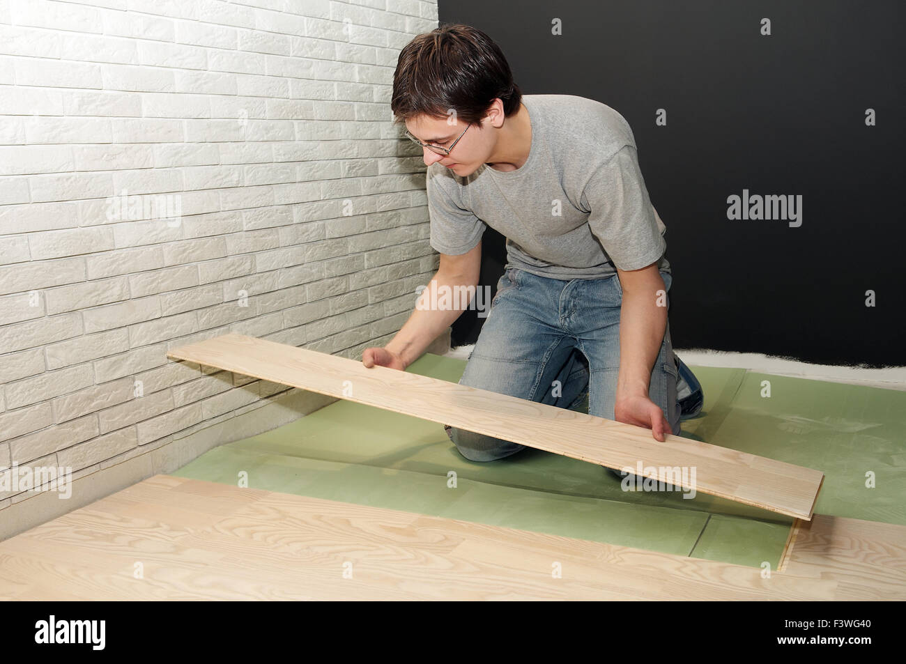 laying work with laminated flooring Stock Photo - Alamy