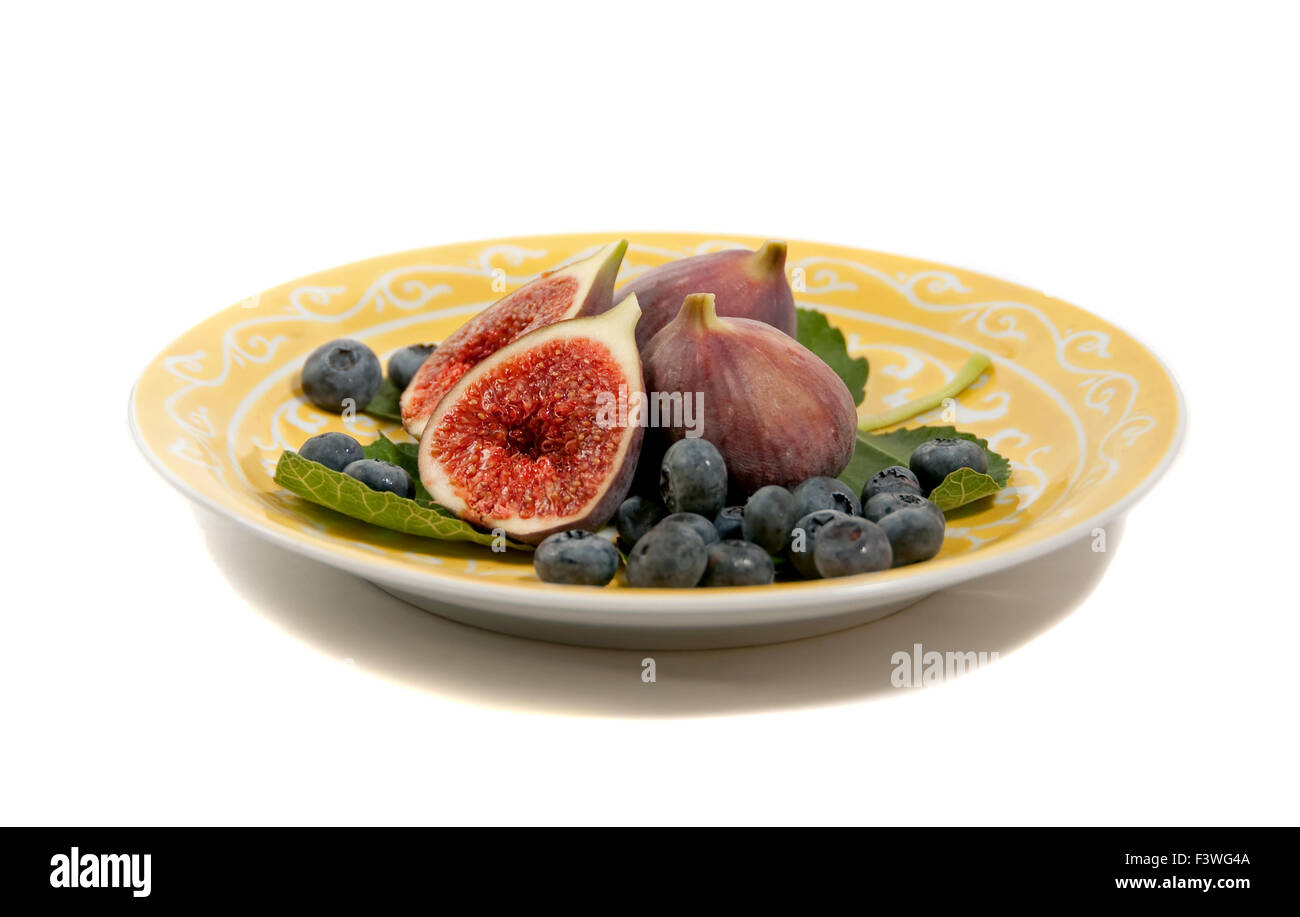 a plate of figs and blueberries Stock Photo - Alamy