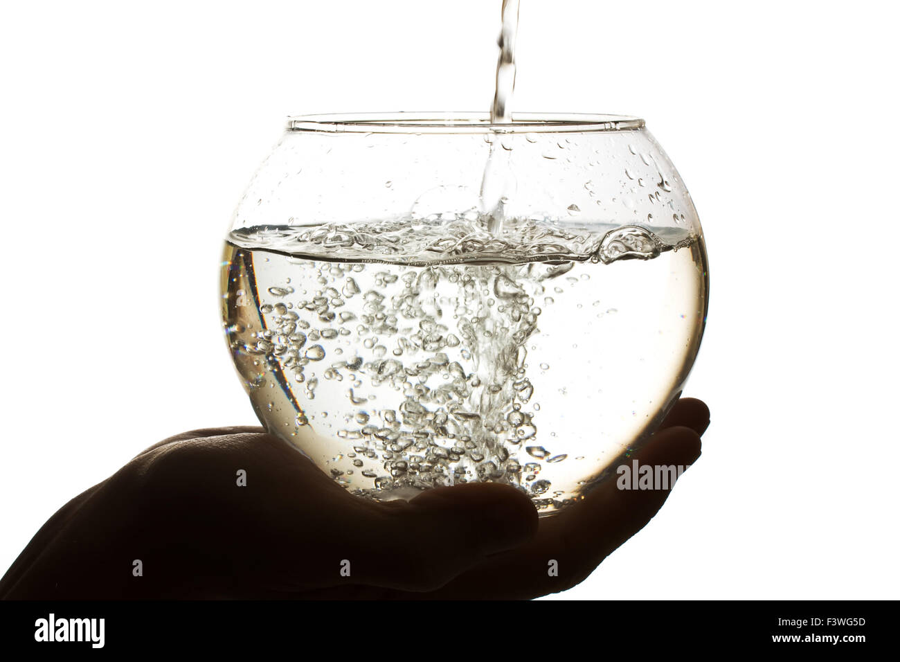 Water is poured into a large glass Stock Photo - Alamy