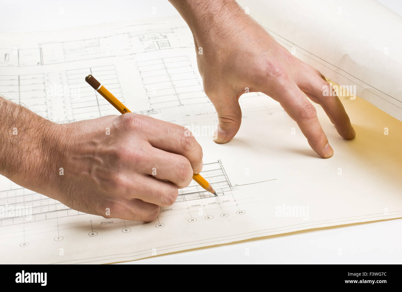 hand draws a pencil on drawing Stock Photo - Alamy