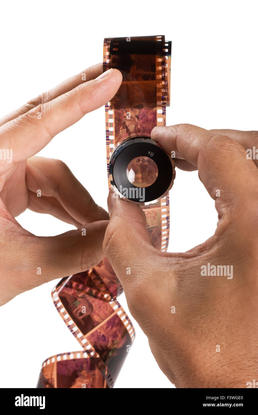 hand holding magnifying glass and film Stock Photo - Alamy