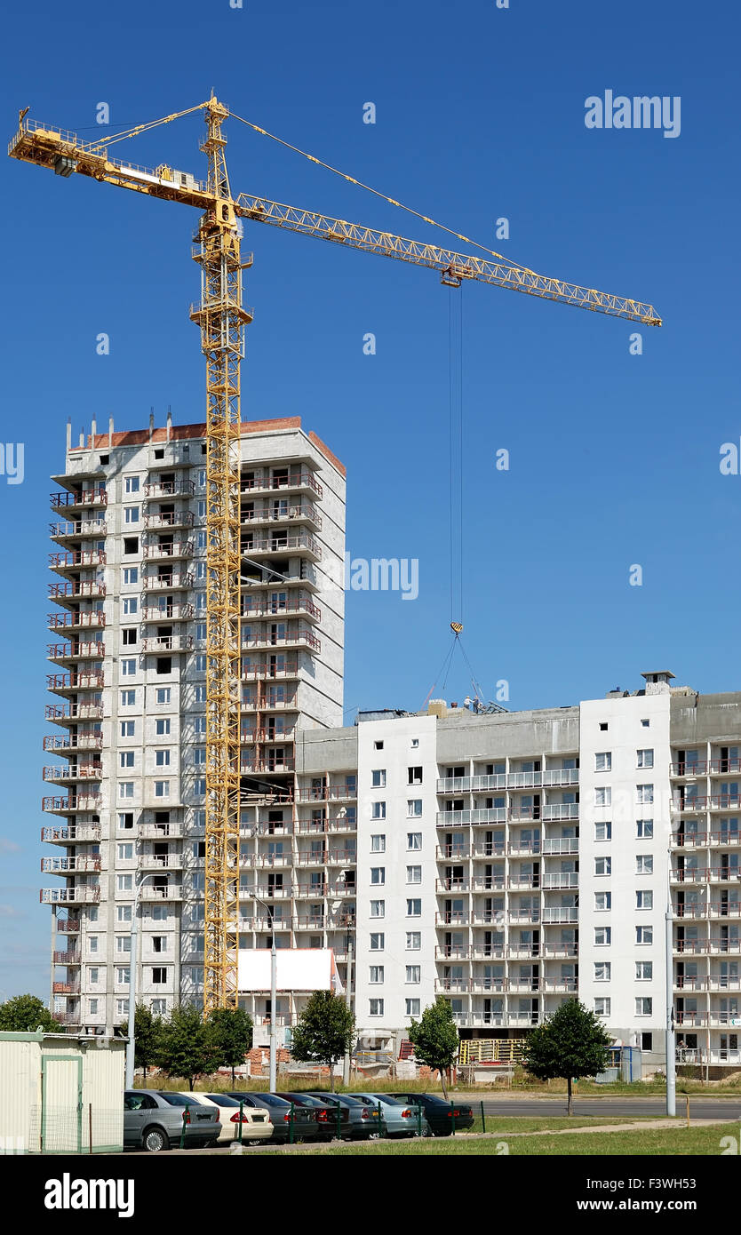 Single tower column crane loader Stock Photo - Alamy