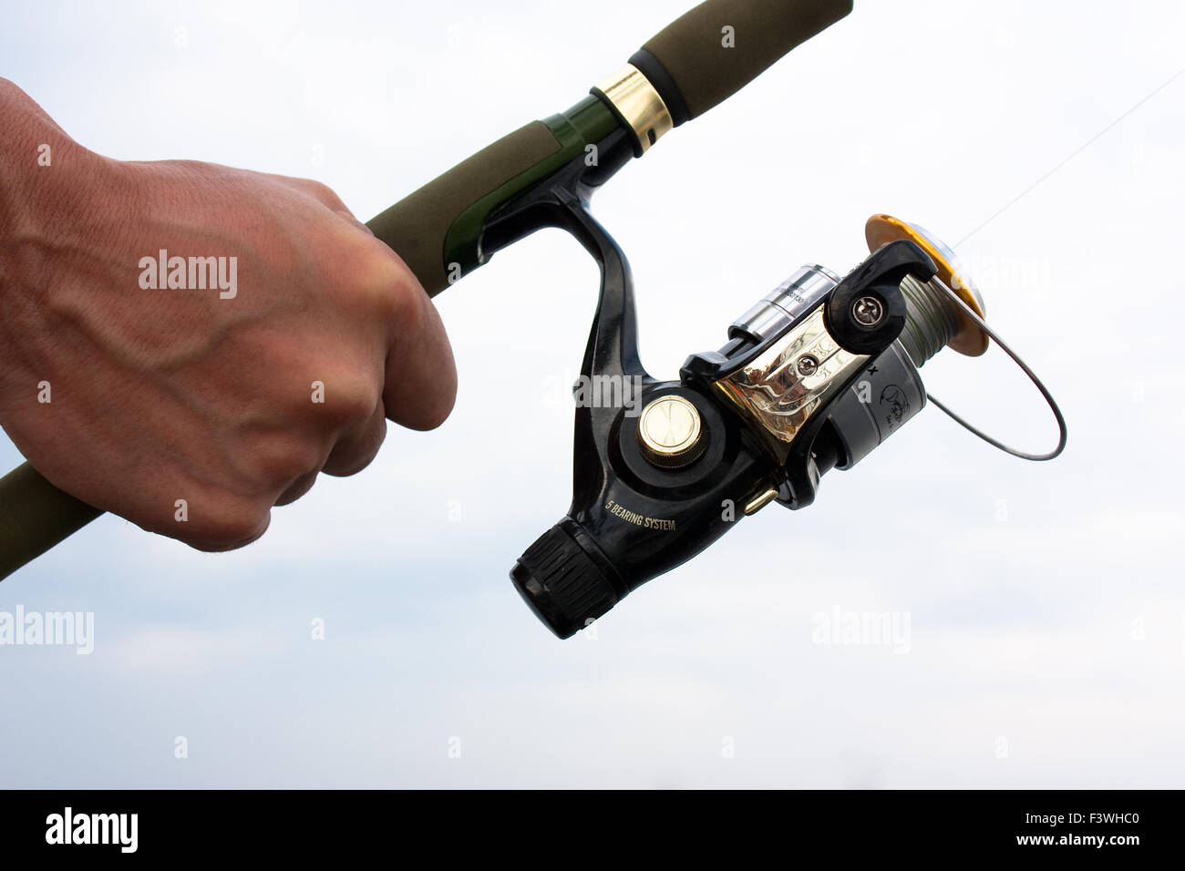 Spinning in his hand Stock Photo - Alamy