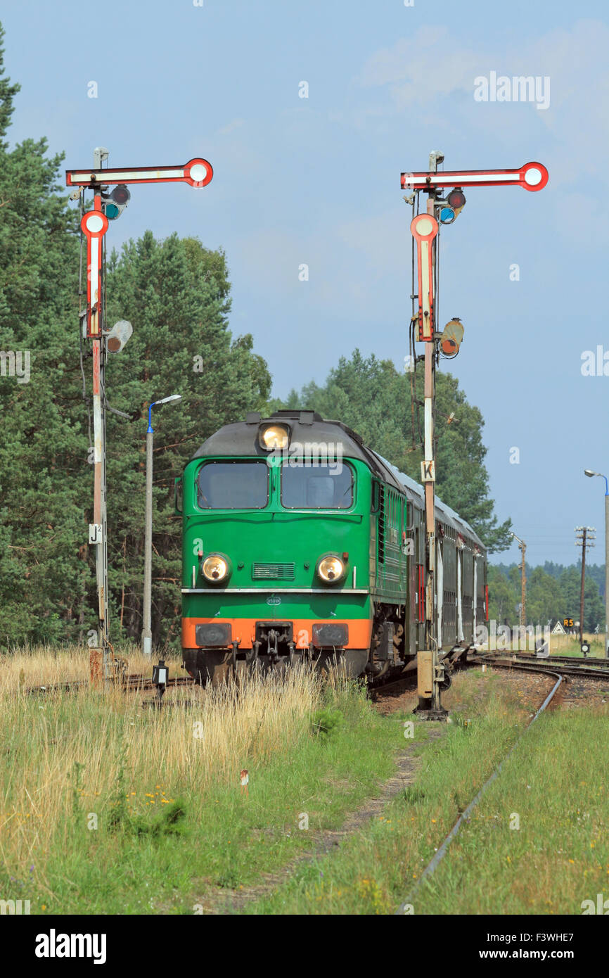 Passenger train entering the station Stock Photo - Alamy