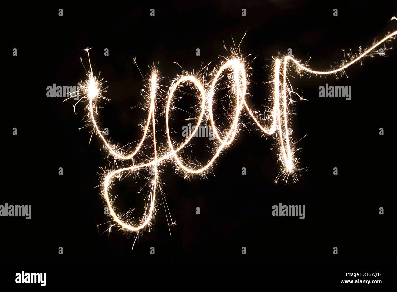Word Year made by sparkler Stock Photo - Alamy