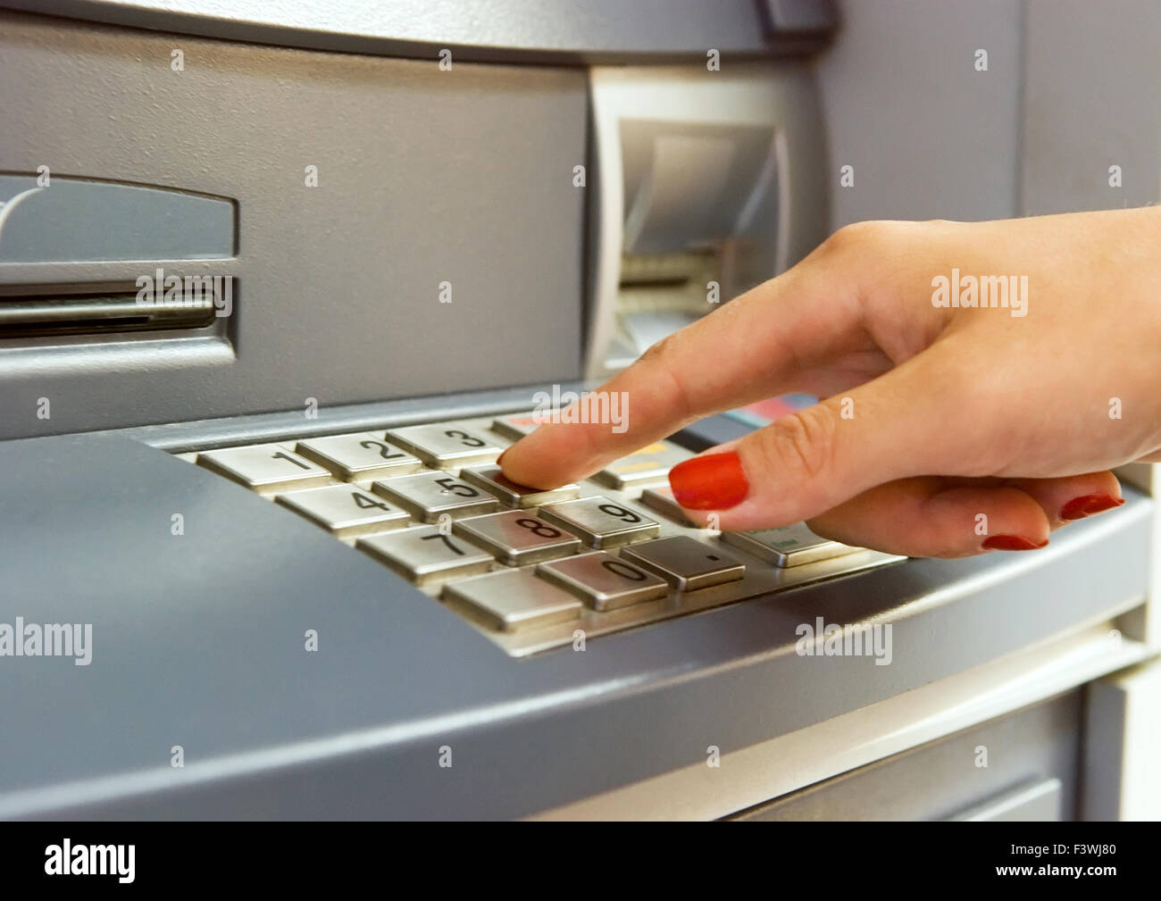Using bank ATM Stock Photo - Alamy