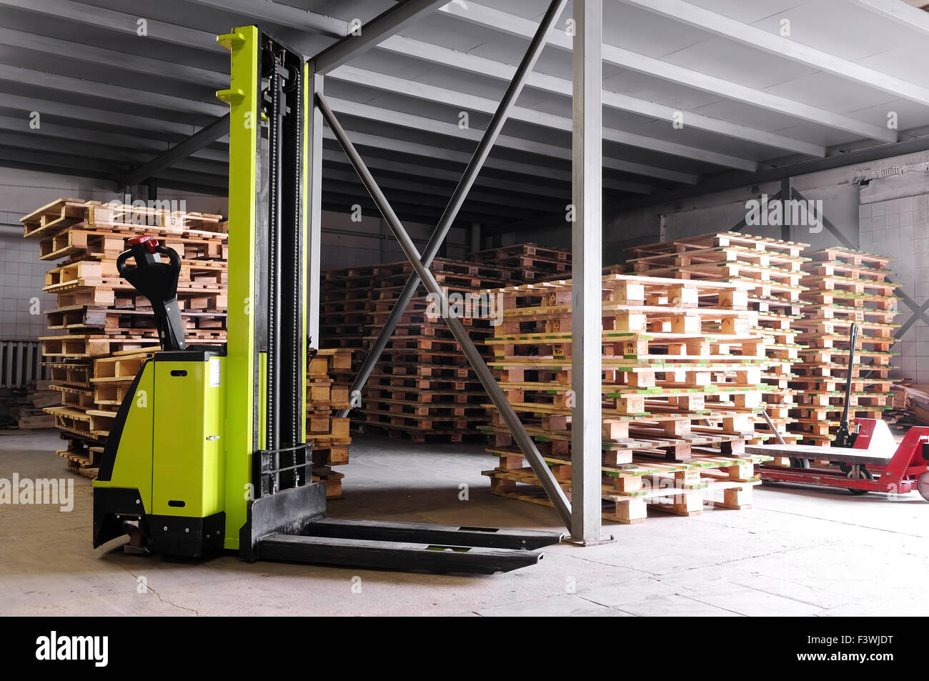 forklifter stacker in warehouse Stock Photo - Alamy