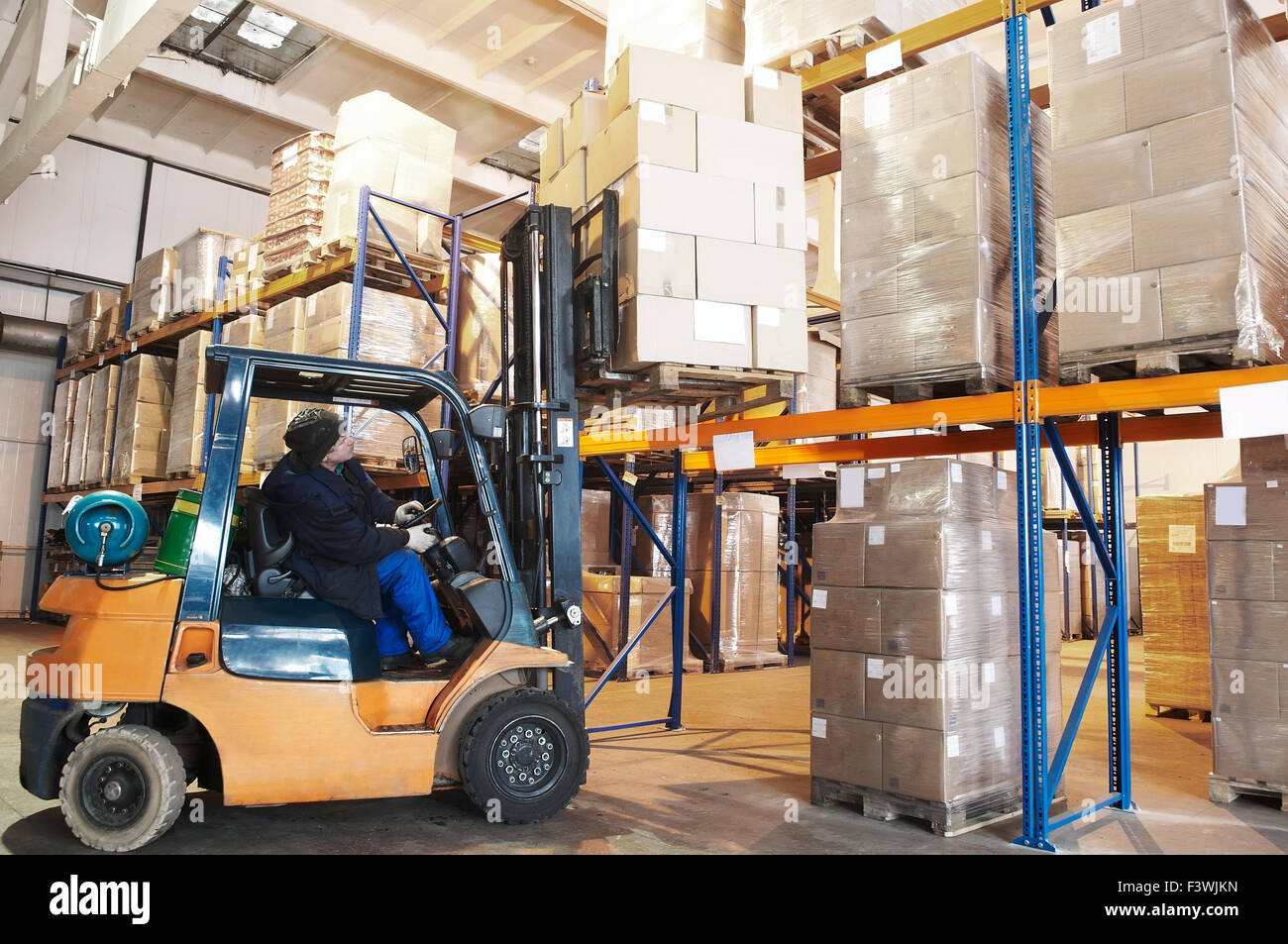 warehouse forklift loader worker Stock Photo - Alamy