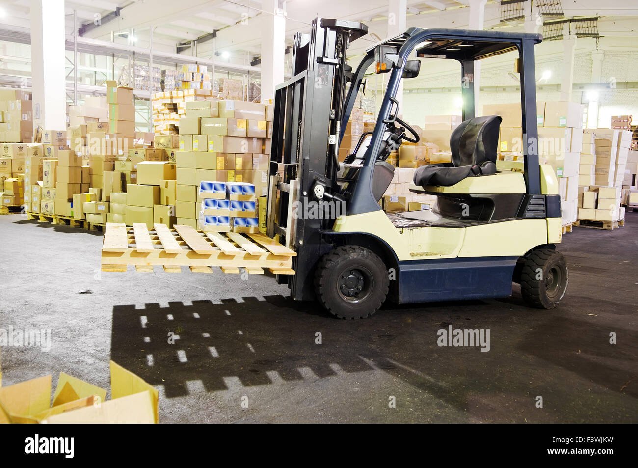 Forklift stacker in warehouse Stock Photo - Alamy
