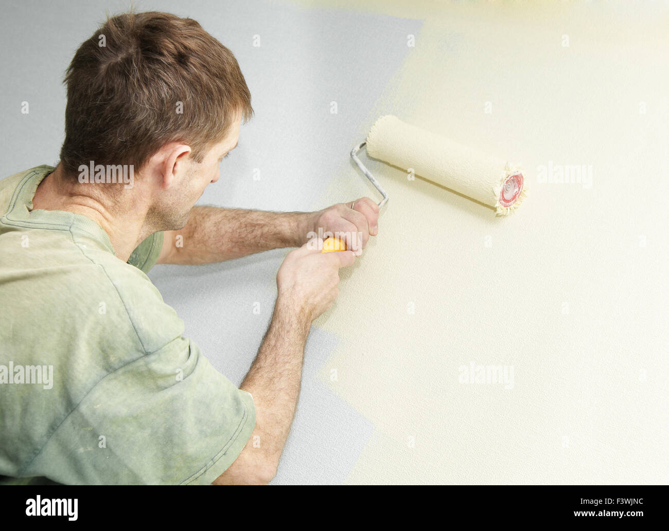 Painter with roller Stock Photo - Alamy