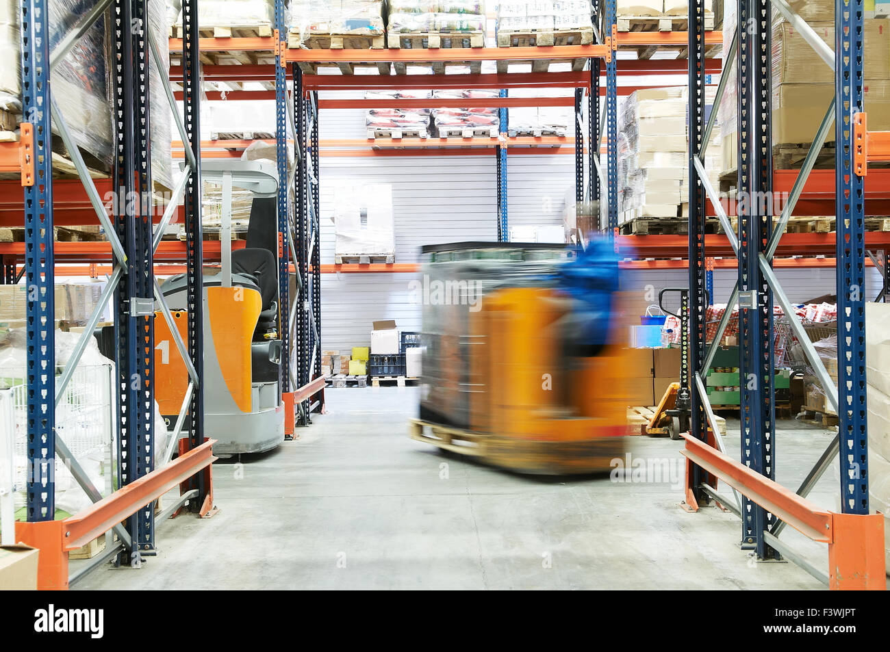 warehouse truck loader works Stock Photo - Alamy
