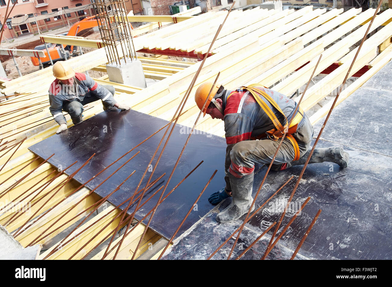 two builders at work Stock Photo - Alamy